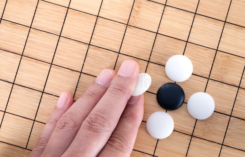 Chinese Go Game on table stock image. Image of game - 228924359