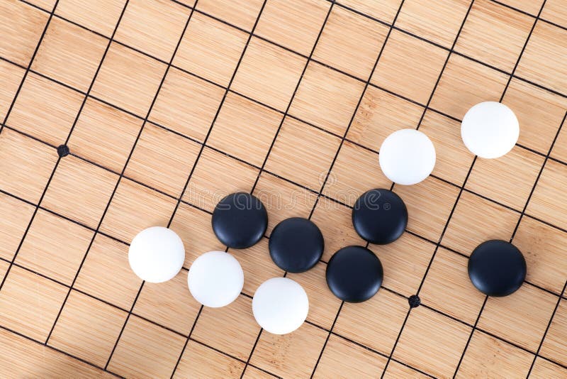 Chinese Go Game on table stock image. Image of leisure - 228924369