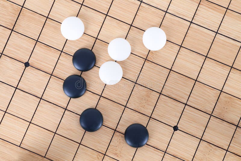 Chinese Go Game on table stock photo. Image of culture - 228924372