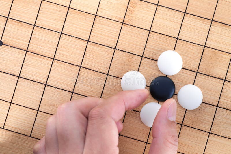 Chinese Go Game on table stock image. Image of inheritance - 228924365