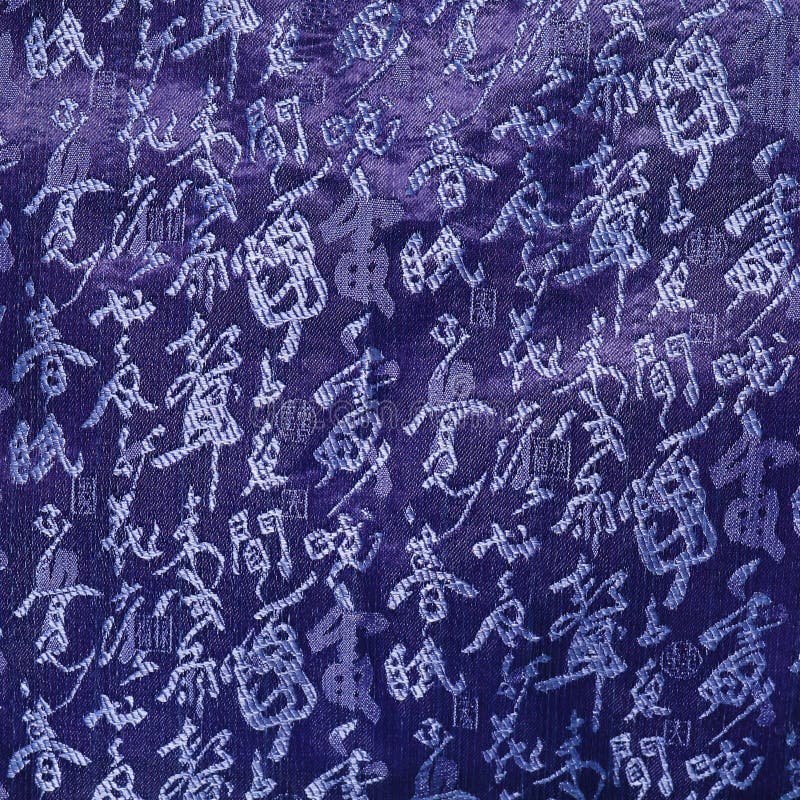 Chinese Hieroglyphs are Embroidered on a Blue Material. Background ...