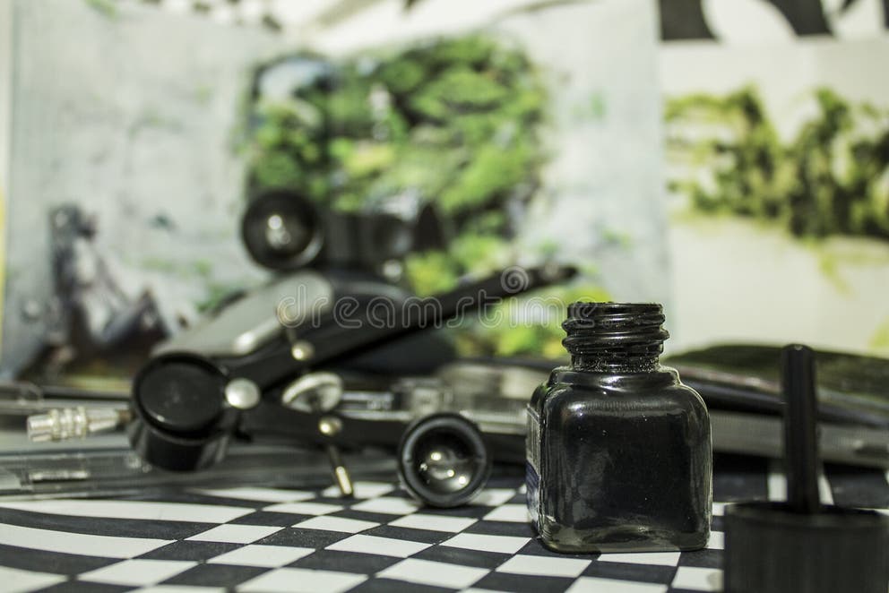 Chinese Ink Container and Drawing Tools on a Checkered Surface Stock ...