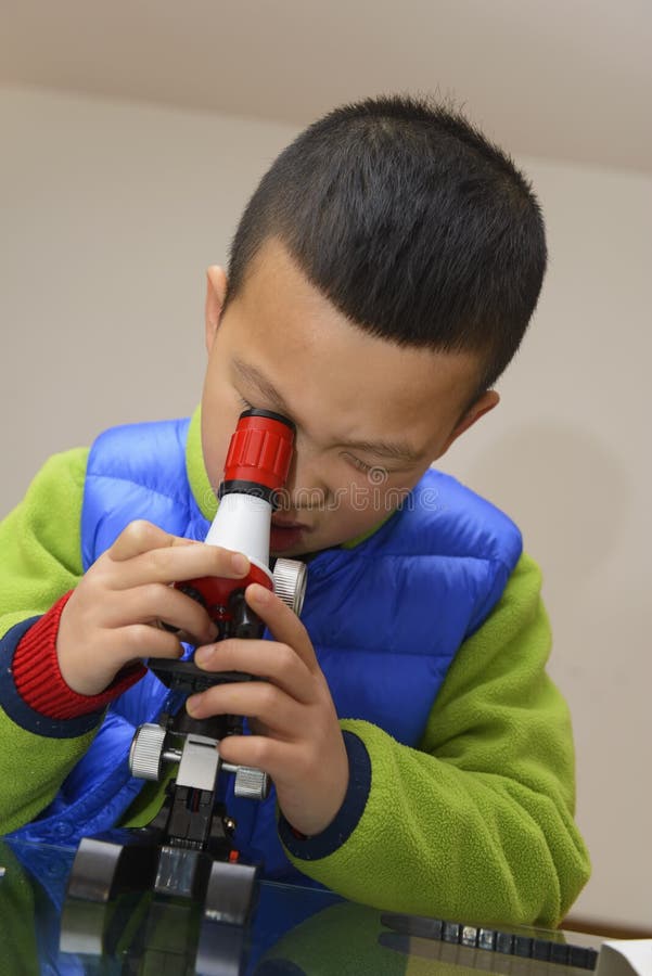 Kid using microscope stock image. Image of playful, professional ...