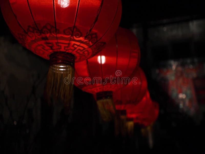 Chinese Lantern & Light Bulb on Dark Background. Stock Video - Video of ...