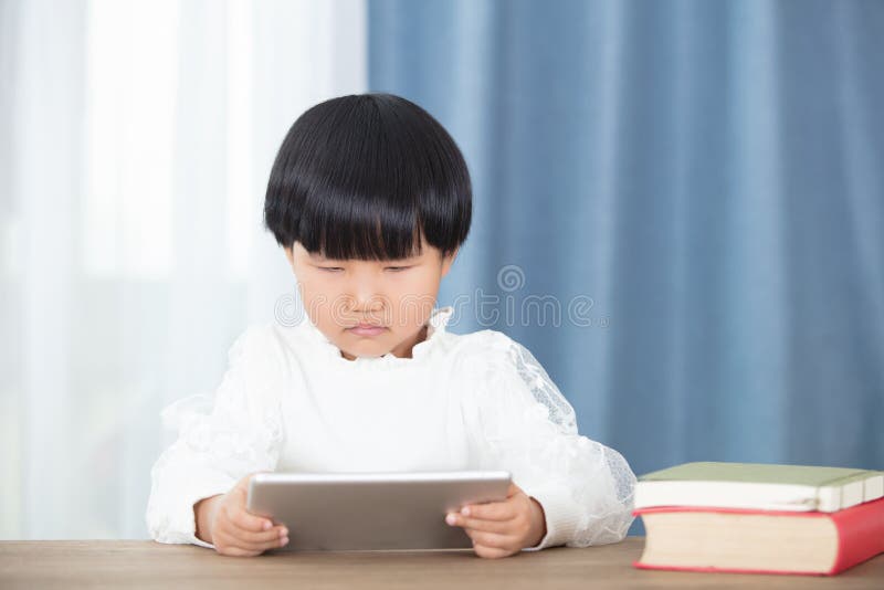 Chinese Little Girl Using Tablet Stock Image - Image of online ...