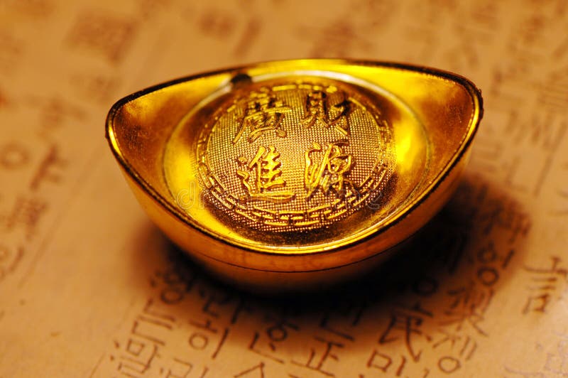 Chinese Lucky Gold Ingot on Calligraphy Backgr Stock Photo - Image of ...