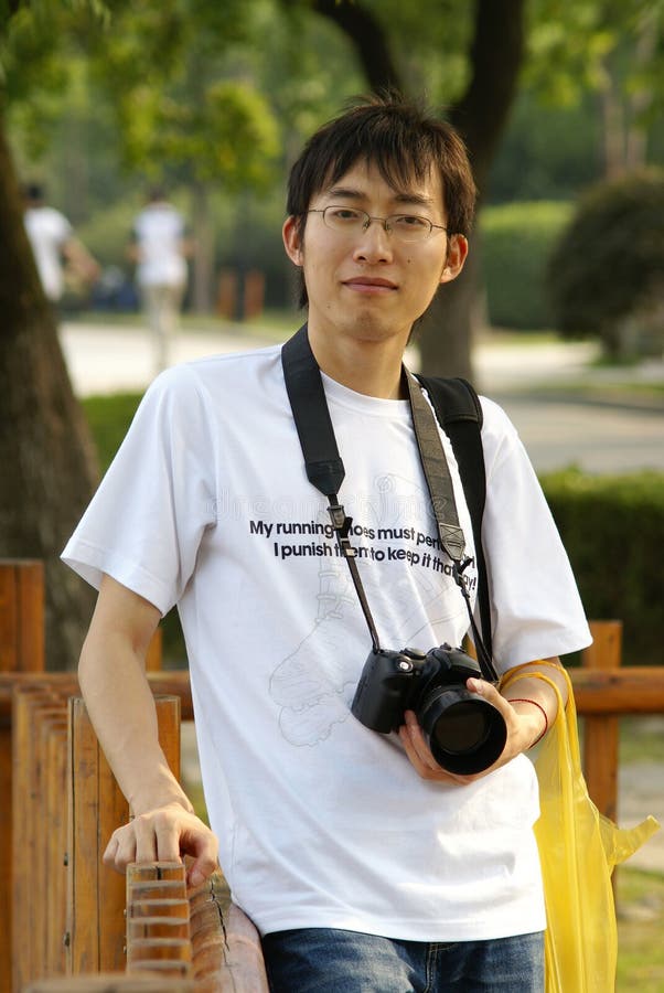 Chinese man with camera stock photo. Image of glasses - 5436040