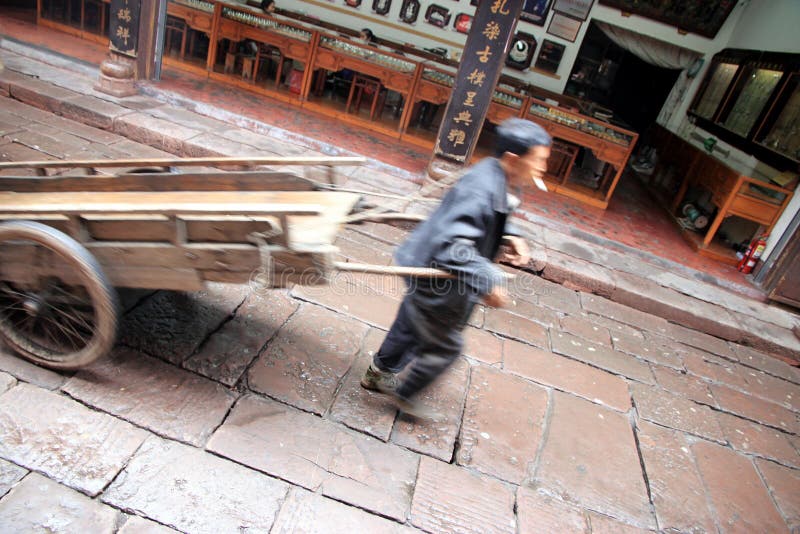 Chinese Man Pulling Cart editorial photo. Image of move - 25901156