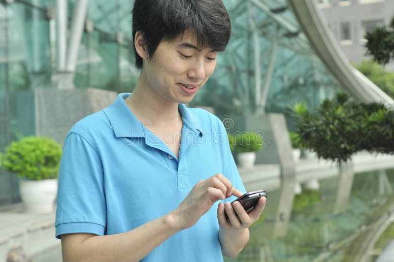 Asian man texting stock image. Image of businessman, communication ...