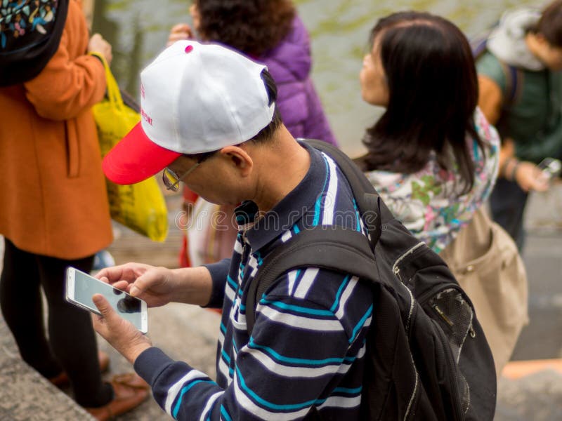 Chinese Man Using Smartphone Editorial Photography - Image of black ...