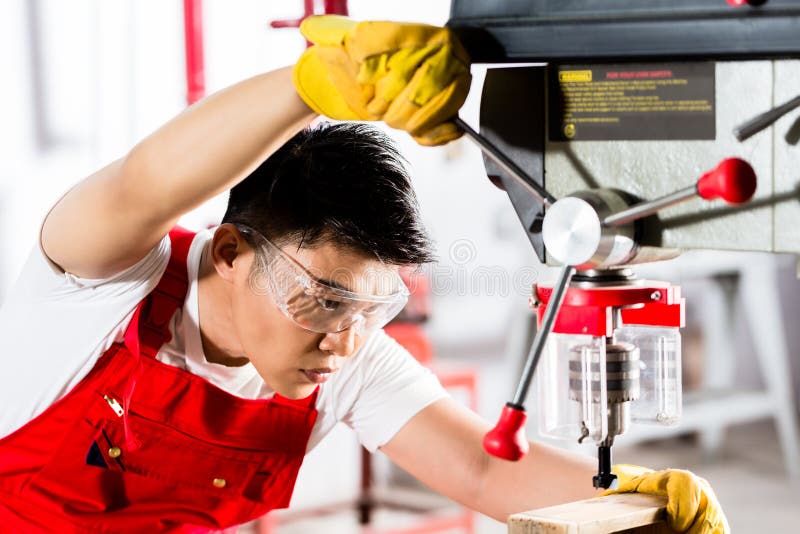 Chinese Man Working with Drill in Factory Stock Image - Image of drill ...