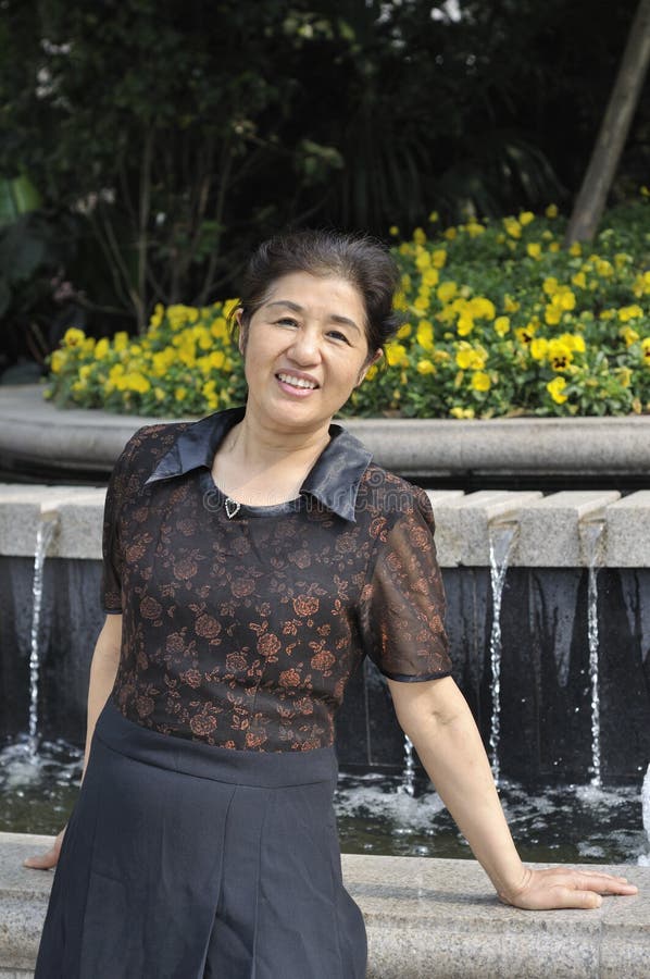 Chinese middle aged woman stock photo. Image of middle - 32331868