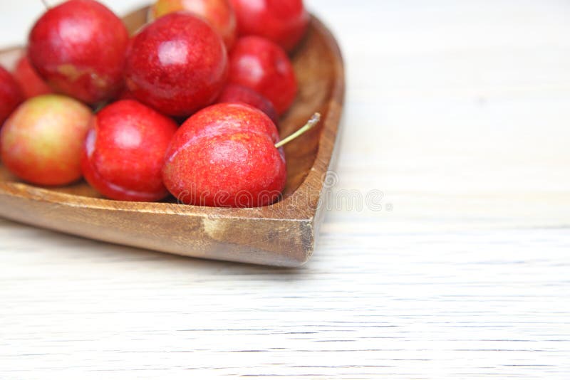 Chinese Plums on the Heart Shape Plate Stock Photo - Image of plate ...
