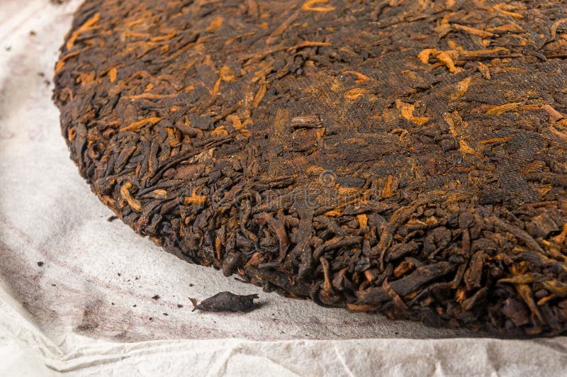 Chinese Pressed PU-erh Tea on Wrapping Paper, Close-up, Macro Stock ...
