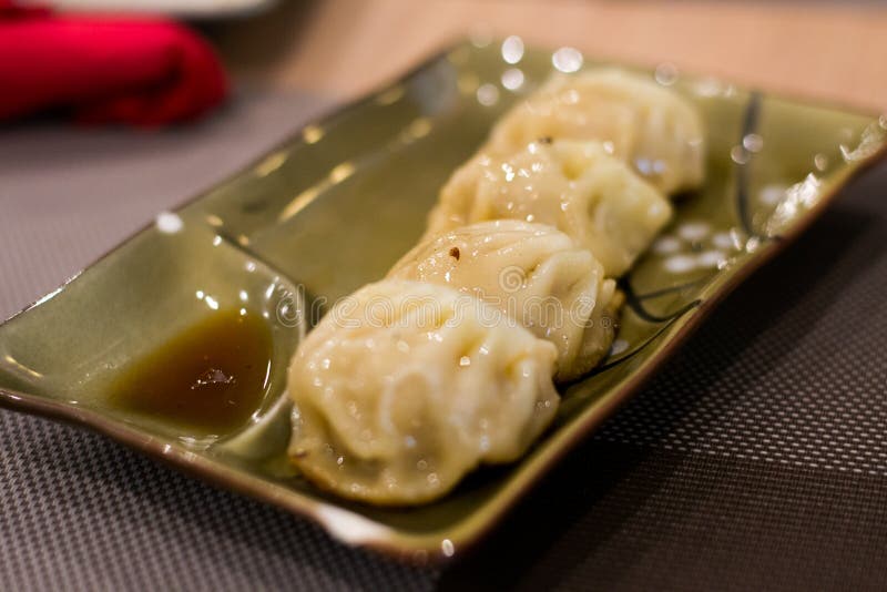 Chinese Ravioli on a Plate with Sauce Stock Photo - Image of sauce ...