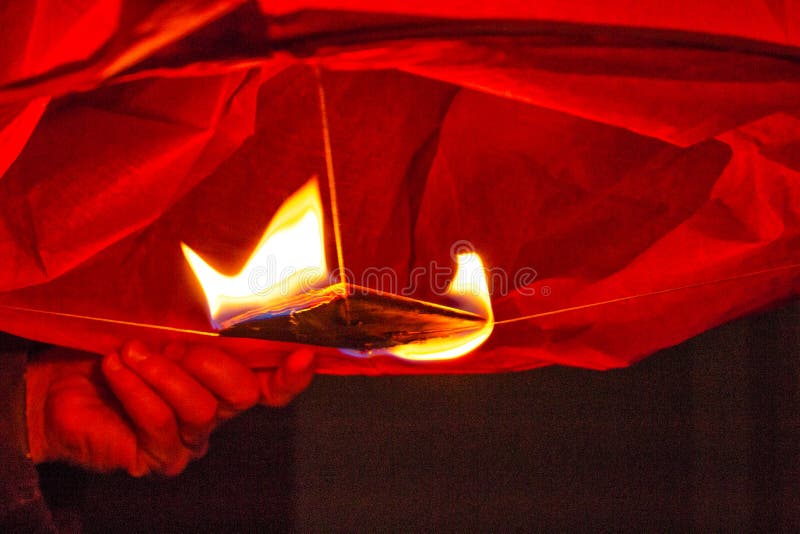 The Chinese Red Lantern Burns with Fire in the Sky. Stock Photo - Image ...