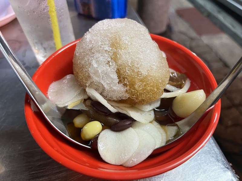 A Chinese Shaved Ice with Dough, Red Beans, Water Chestnuts, and Syrup ...