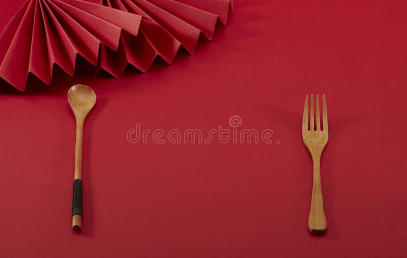 Chinese Style Red Background and Red Folding Fan with Wooden Fork and ...
