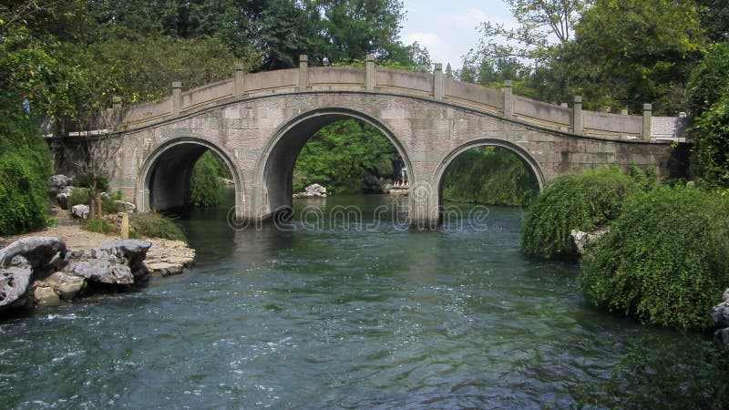A Chinese Style Stone Bridge Above River in Hangzhou China Stock Photo ...