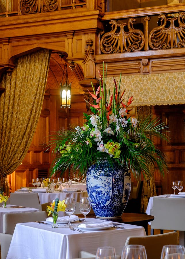 Chinese Style Vase with Flowers with a Restaurant Interior on Th Stock ...