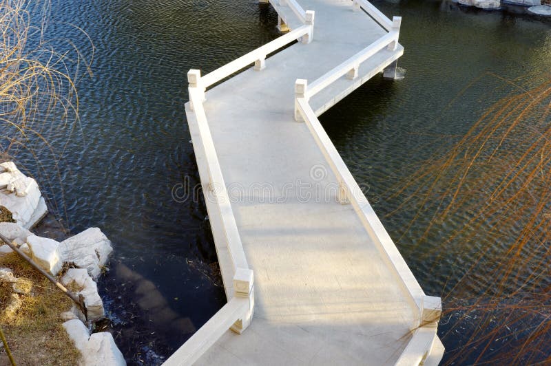 Chinese Style Winding Bridge Stock Photo - Image of stone, plant: 3930504