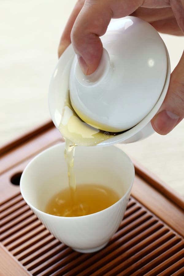 Pouring Green Tea from Pot stock image. Image of fresh - 7694829