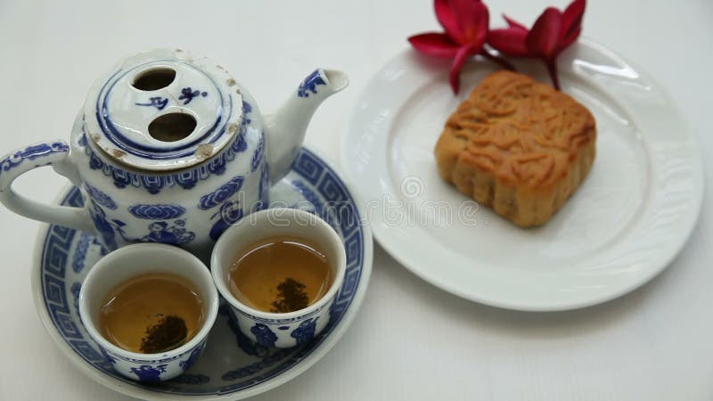 Chinese Tea Set with Mooncake and Red Flowers in Natural Light Stock ...