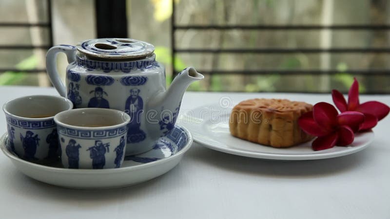 Chinese Tea Set with Mooncake and Red Flowers in Natural Light Stock ...