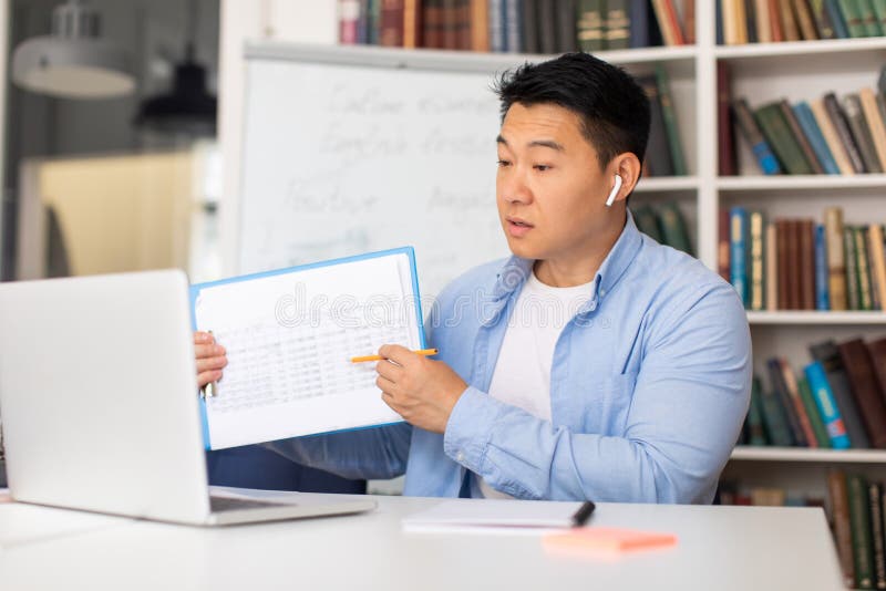 Chinese Teacher Male Having Online Class Via Laptop At Workplace Stock Image Image Of