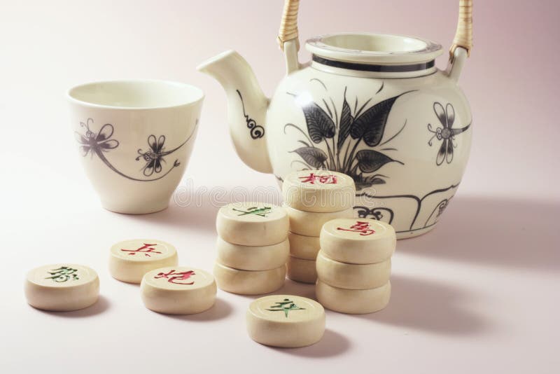 Chinese Teapot and Teacup with Chess Pieces Stock Photo - Image of ...