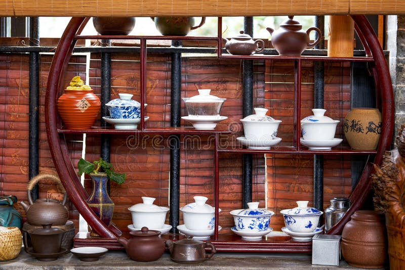 Chinese Traditional Tea Sets, Teapots and Cups on Mahogany Shelf Stock ...