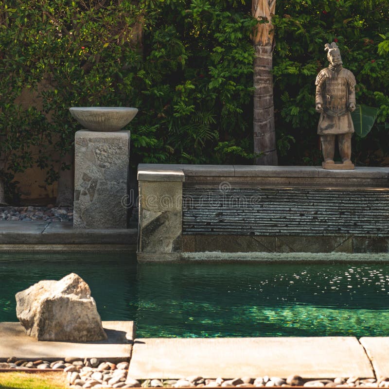 Chinese Warrior Statue Behind a Pool on a Sunny Day Stock Image - Image ...