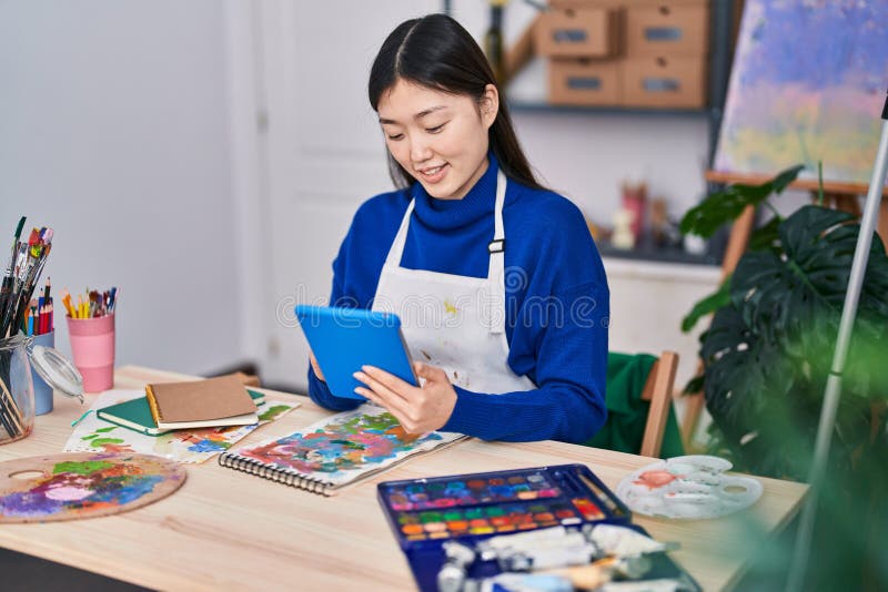 Chinese Woman Artist Using Touchpad Drawing on Notebook at Art Studio ...