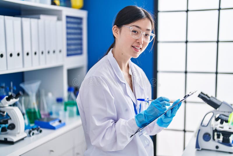 Chinese Woman Scientist Writing on Document at Laboratory Stock Image ...