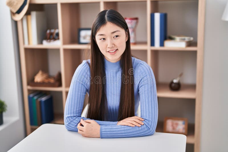 Chinese Woman Smiling Confident Sitting on Sofa at Home Stock Image ...