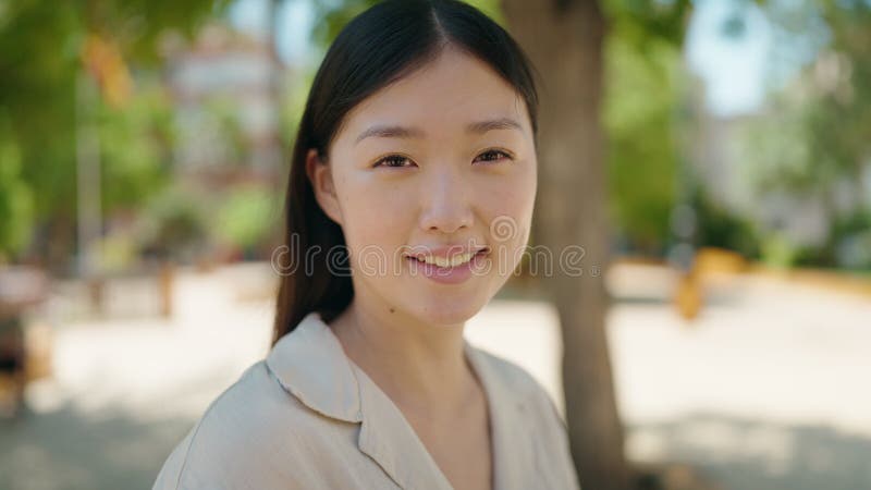 Chinese Woman Smiling Confident Standing at Park Stock Footage - Video ...