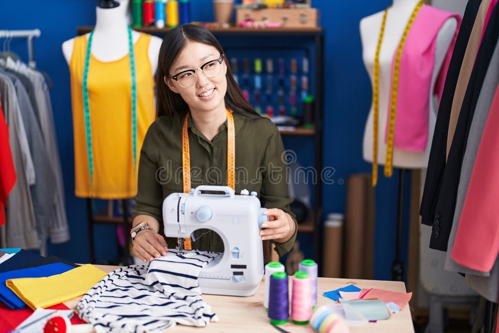 Chinese Woman Tailor Smiling Confident Using Sewing Machine at Sewing ...