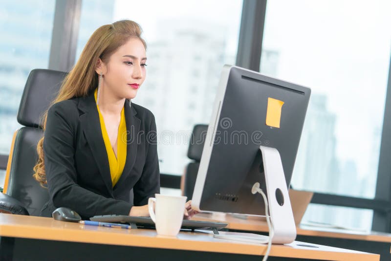 Chinese Woman Working with Computer Laptop in Modern City Office Stock ...