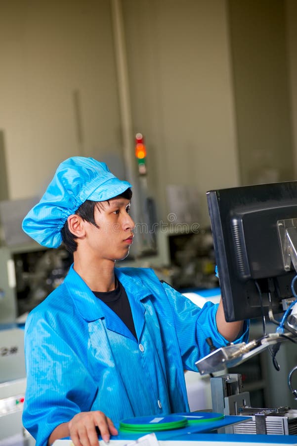 Asian Factory Worker Look on the Technician Screen Stock Image - Image ...