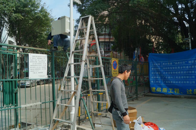 Chinese Workers in the Maintenance of Power Facilities Editorial Stock ...