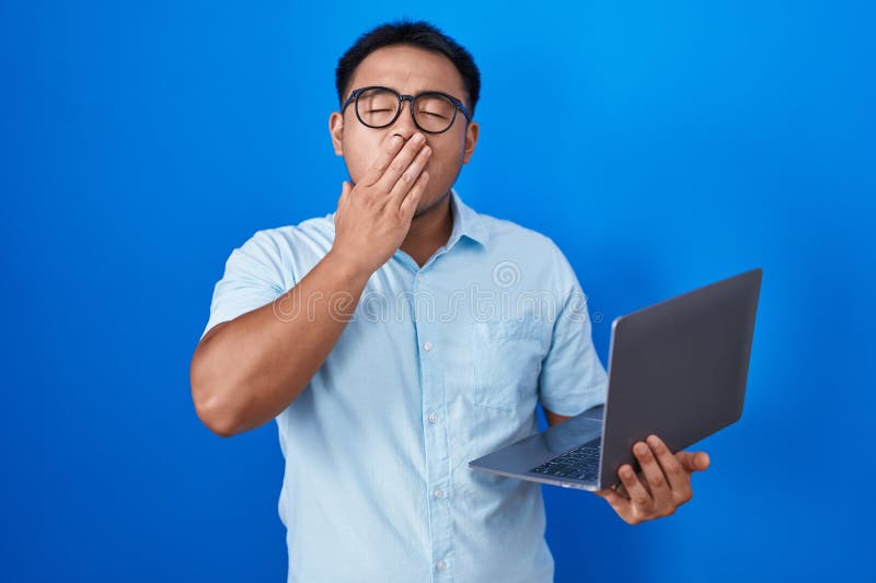 Chinese Young Man Using Computer Laptop Bored Yawning Tired Covering ... Chinese Young Man Using Computer Laptop Bored Yawning Tired Covering ...