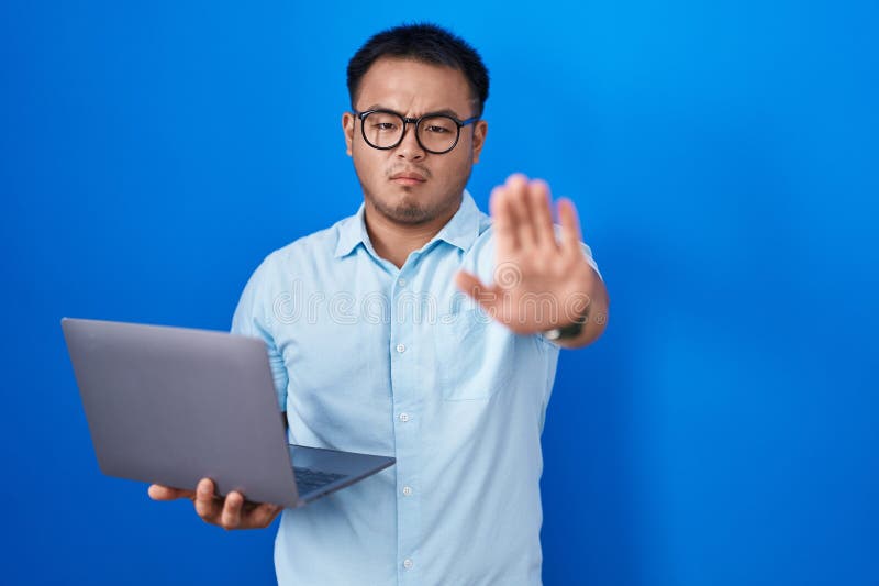 Chinese Young Man Using Computer Laptop Doing Stop Sing with Palm of ...