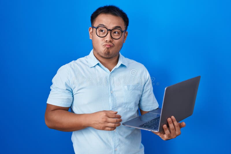 Chinese Young Man Using Computer Laptop Making Fish Face with Lips ...