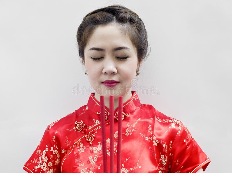 Chinese Young Woman Holding Joss Sticks Stock Photo - Image of female ...