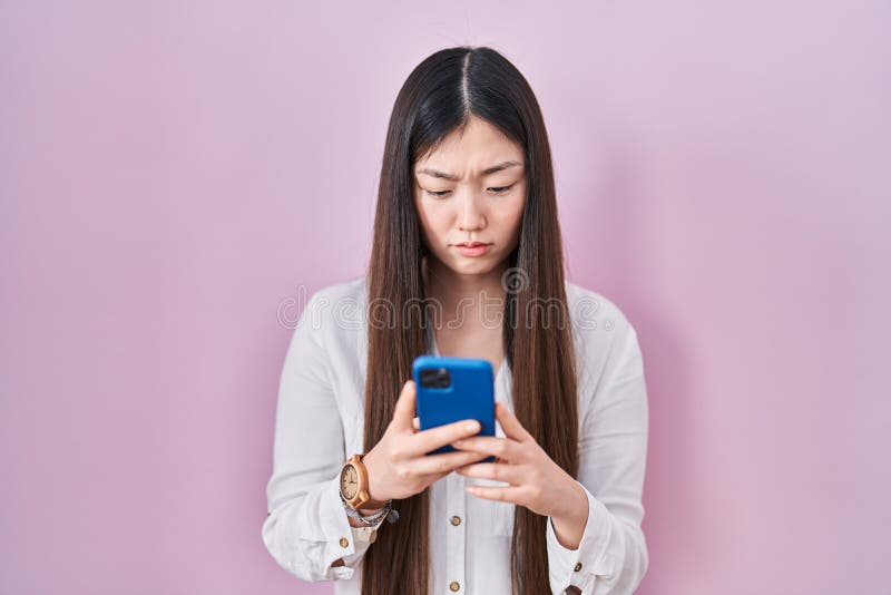 Chinese Young Woman Using Smartphone Typing Message Depressed and Worry ...