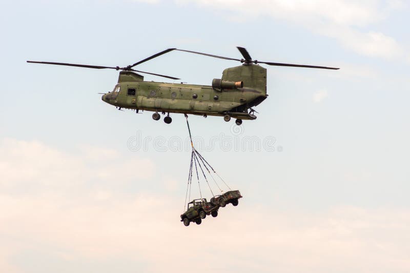 Chinook carrying artillery stock image. Image of troops - 1214791