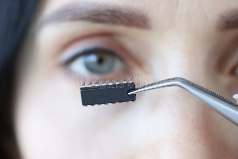 Chip is Inserted into Womans Eye with Tweezers Closeup Stock Image ...