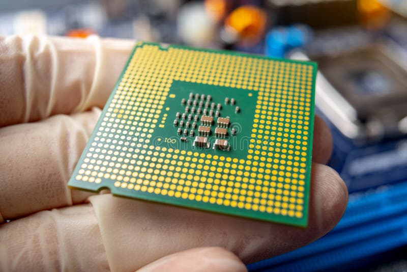 Microprocessor in Hands in Latex Gloves in a Sterile Suit Close-up. the ...