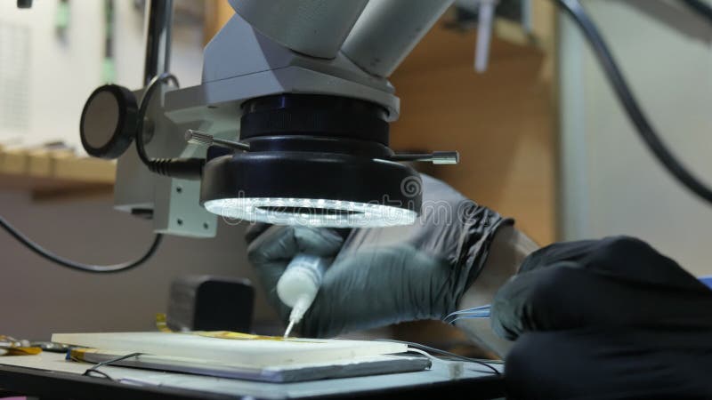 Chip Repair Under a Microscope Stock Footage - Video of microchip ...