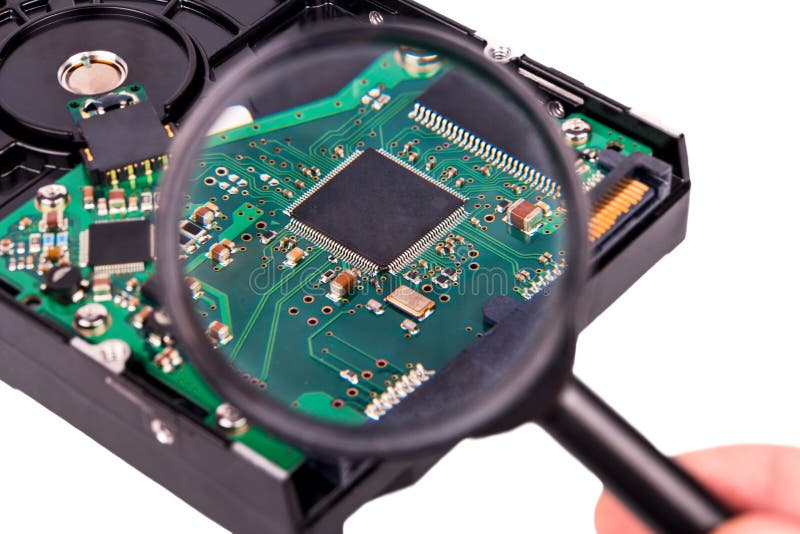 Chip Under Magnifying Glass Stock Image - Image of hard, black: 64219119